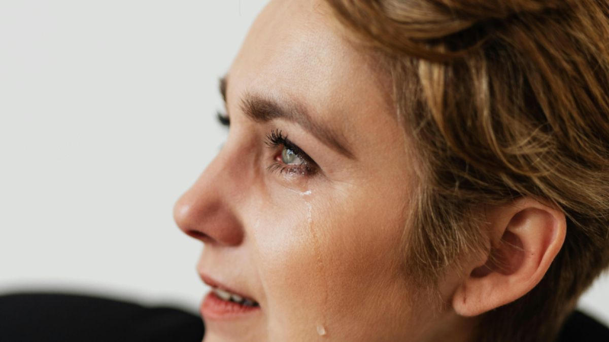 is crying while laughing normal