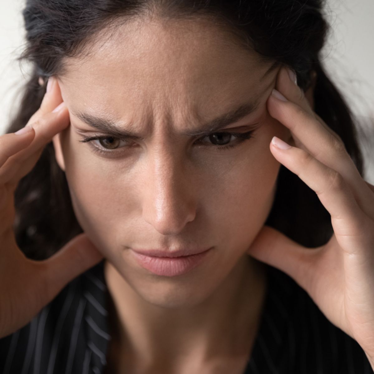 scratching nose while talking