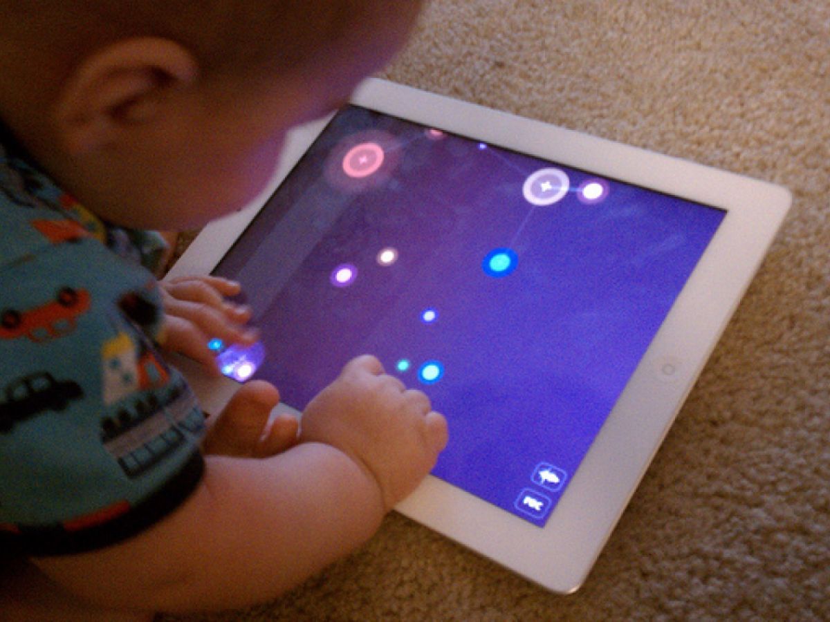 boy playing ipad