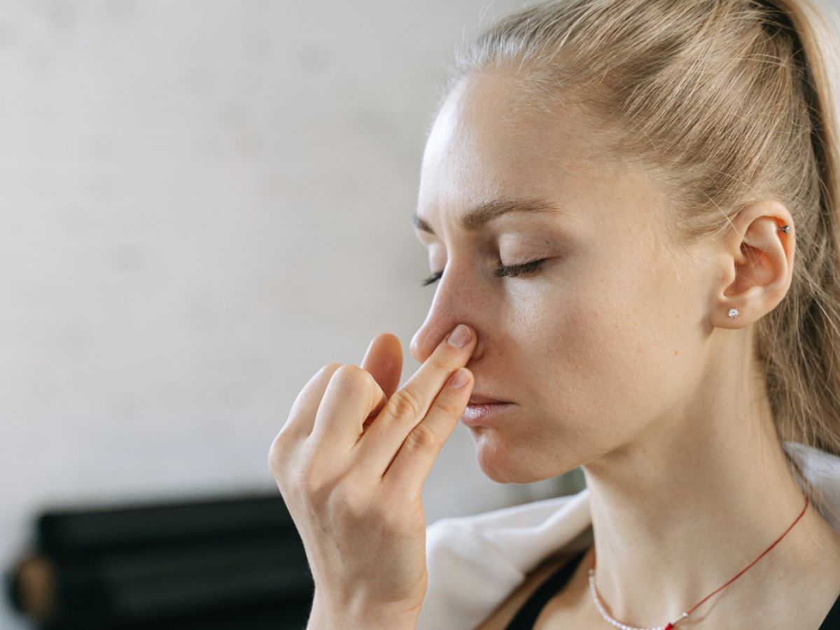 scratching nose lying